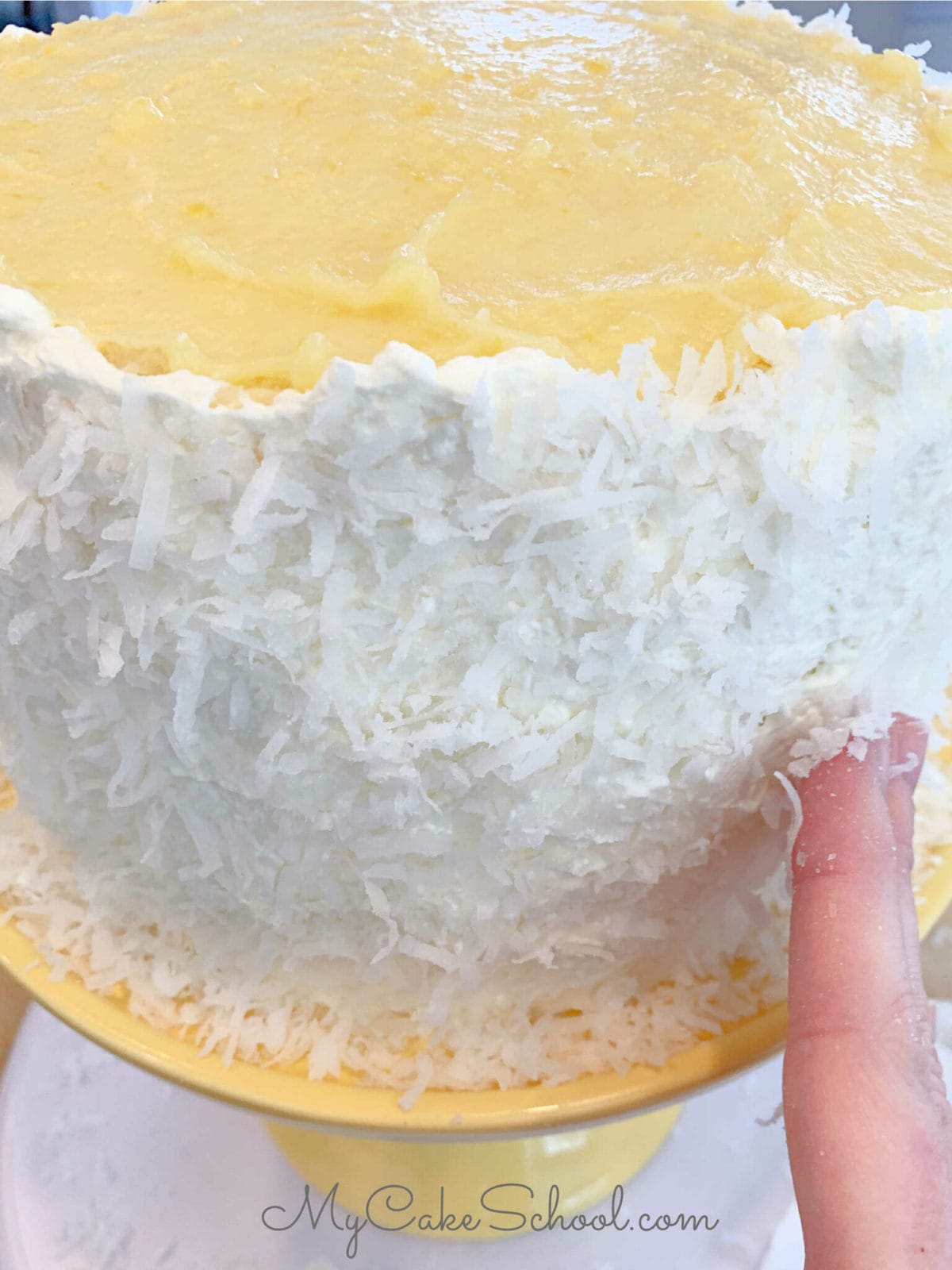 Lemon Coconut Cake with Lemon Curd Filling - My Cake School