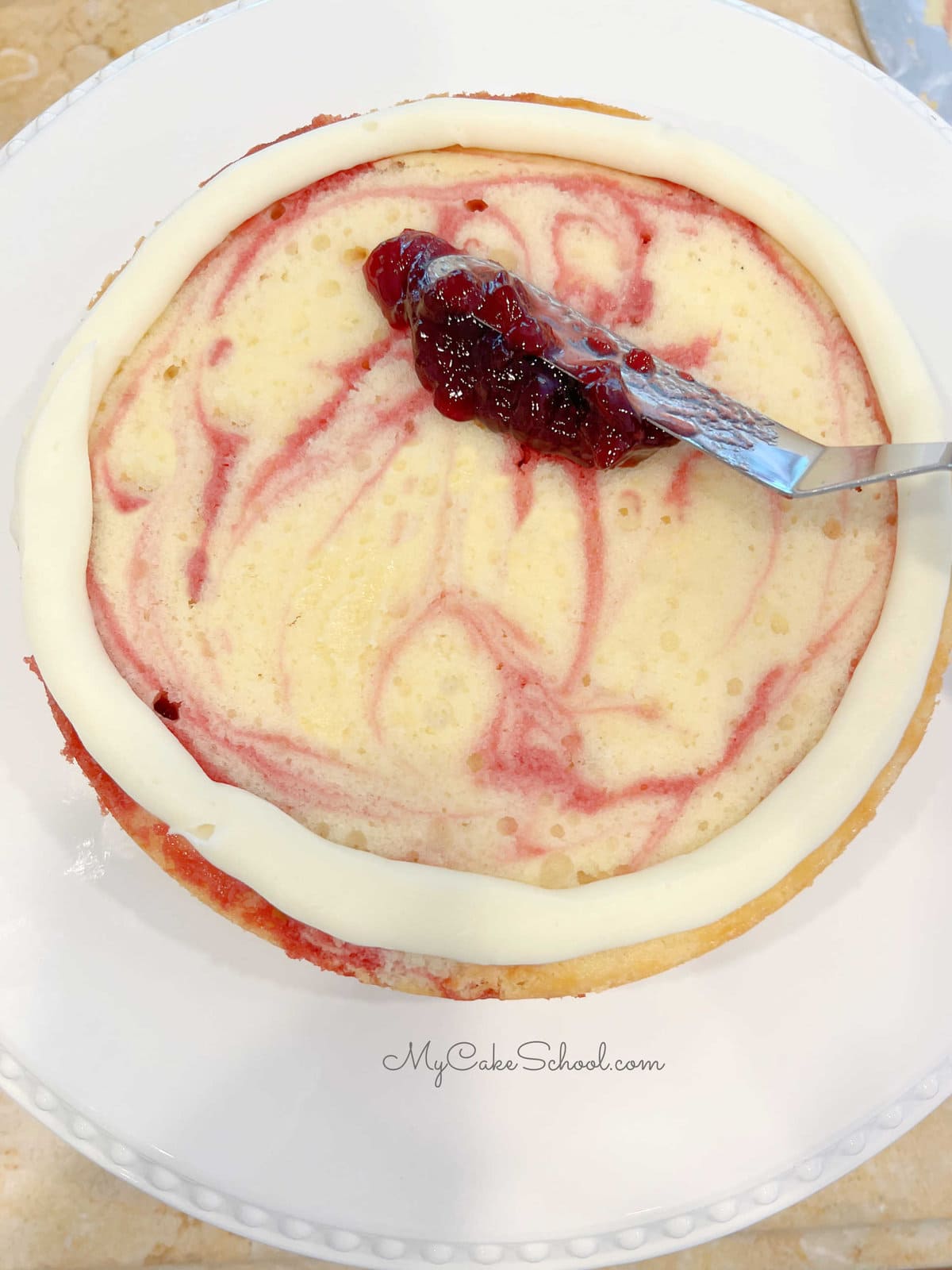 Almond Raspberry Swirl Cake - My Cake School